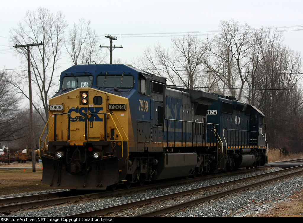 CSX 7909 trails on Q243